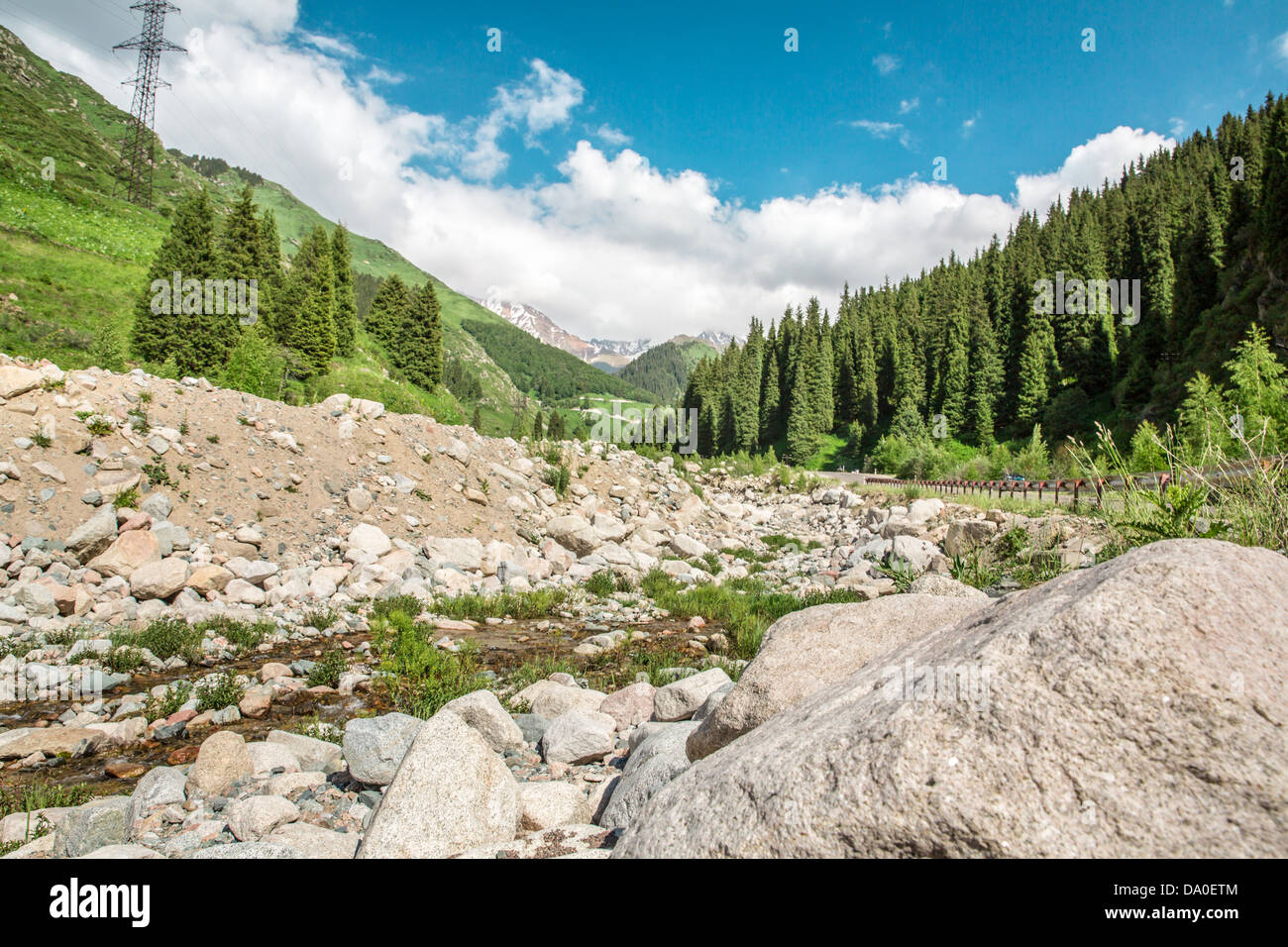 Road on Big Almaty Lake, nature green mountains and blue sky in Almaty ...