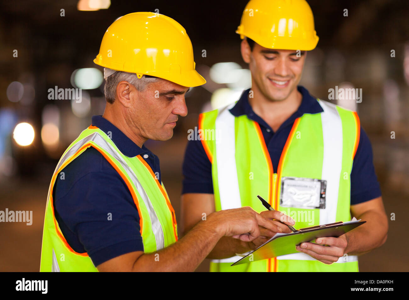 two warehouse workers checking stock Stock Photo - Alamy