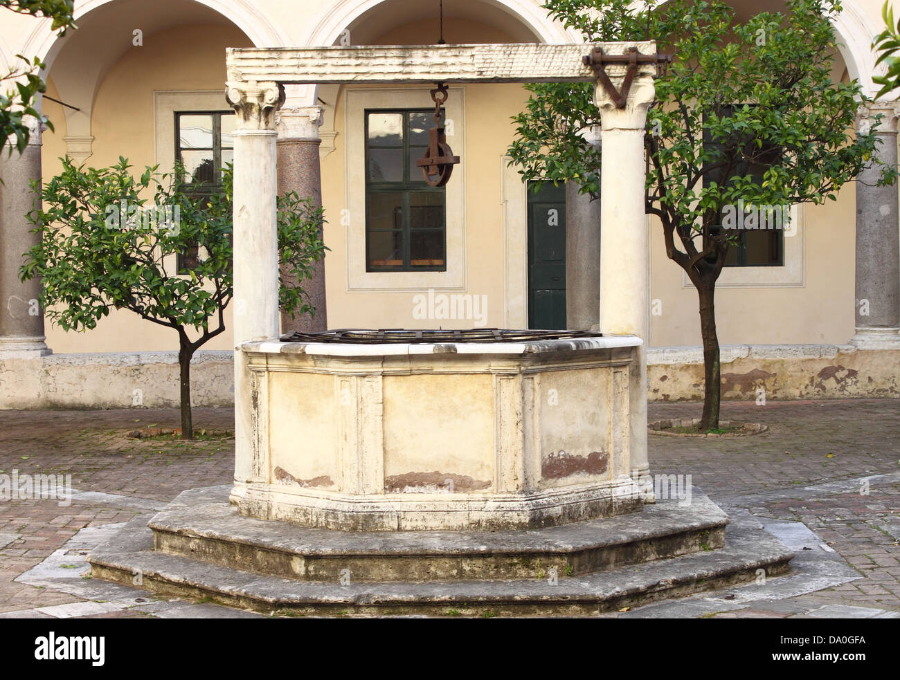 Medieval water well in a cloister Stock Photo - Alamy
