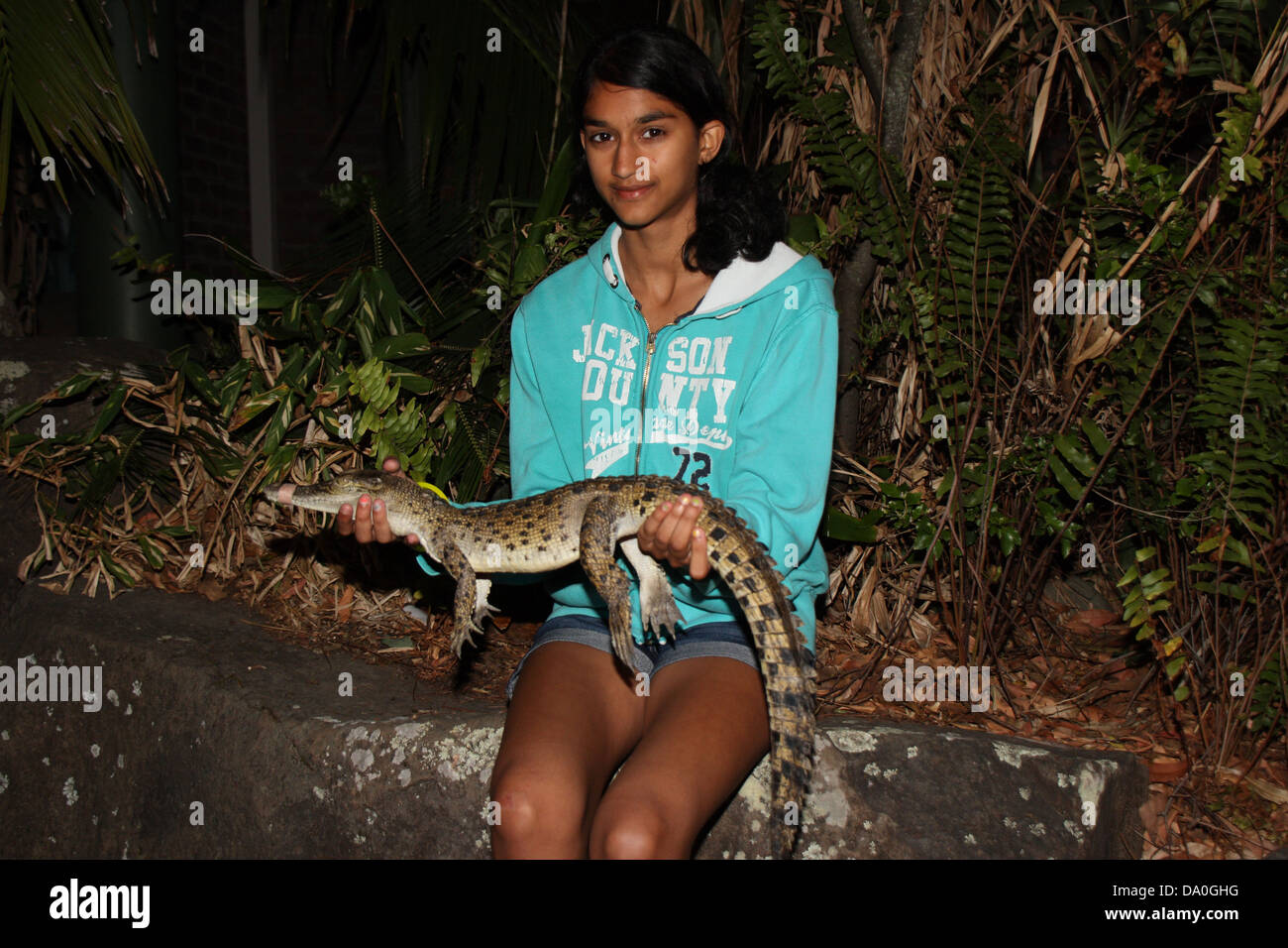 Girl and crocodile hi-res stock photography and images - Alamy