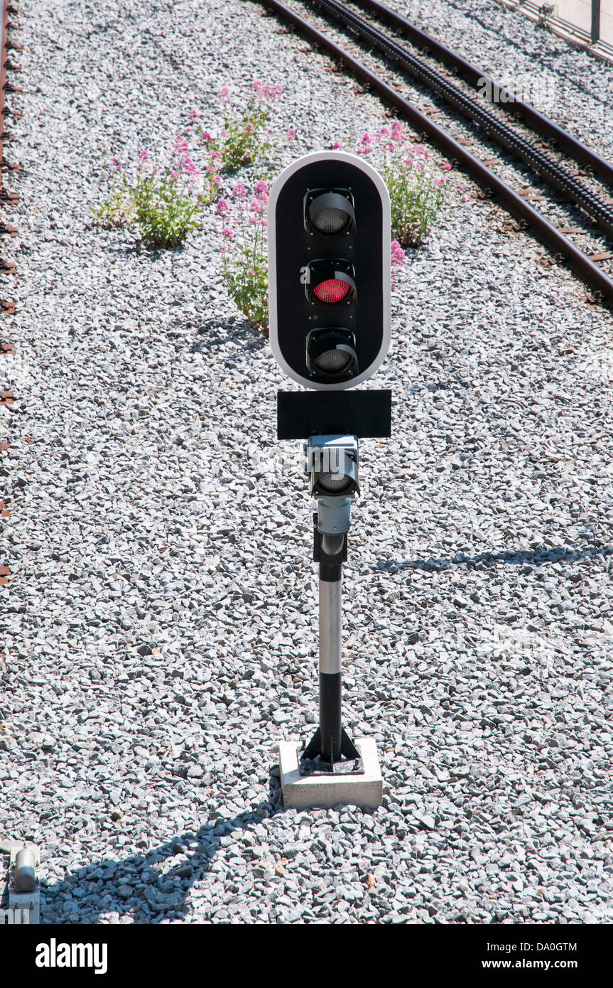 red traffic light on the train tracks Stock Photo - Alamy