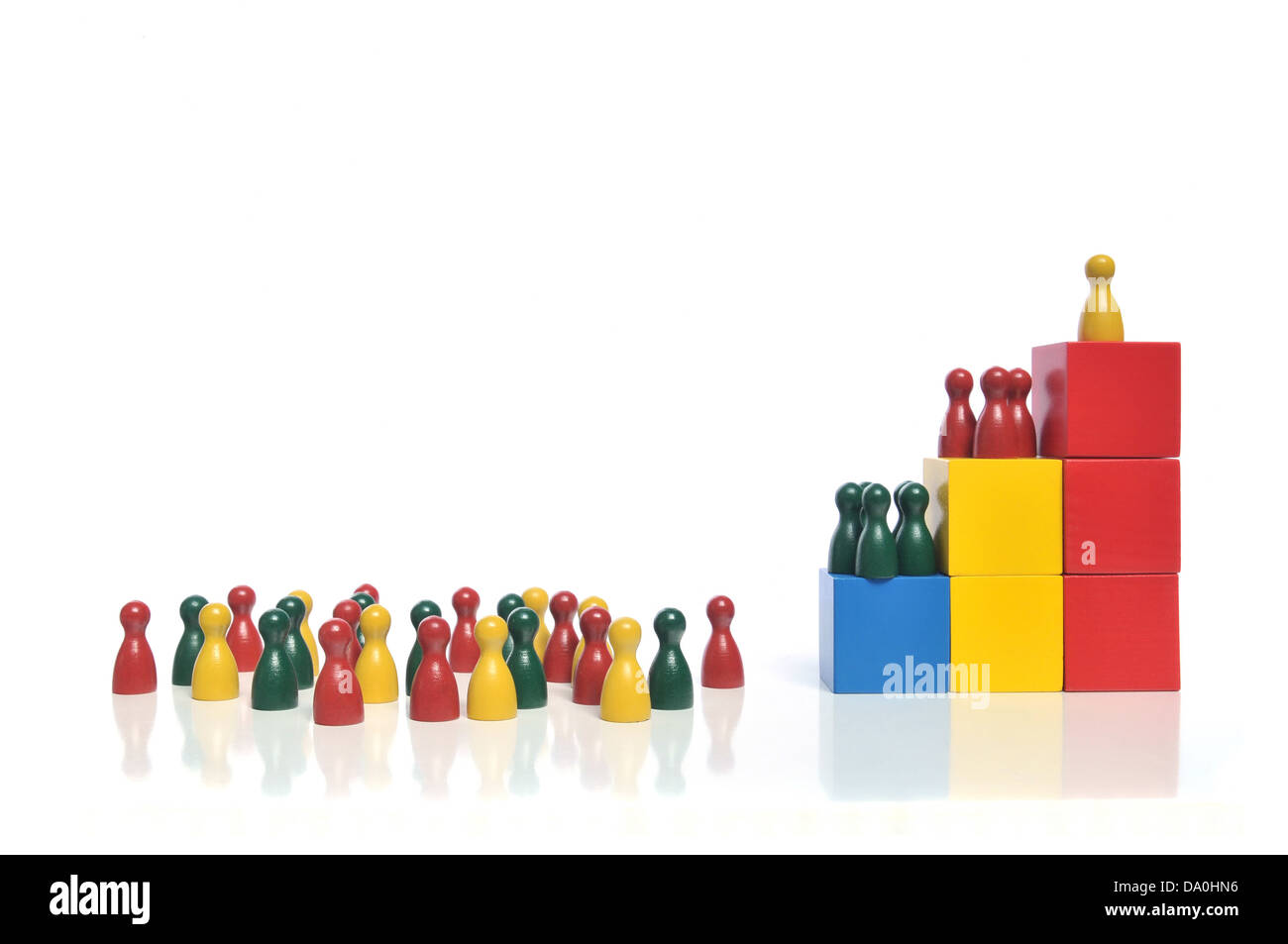 Hierarchy - Multicolored wooden toy blocks and figures on white ...
