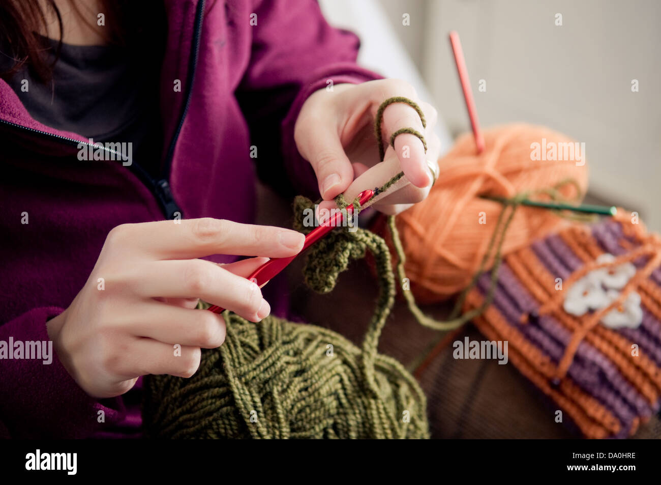 Close up of hands crocheting with wool Stock Photo - Alamy