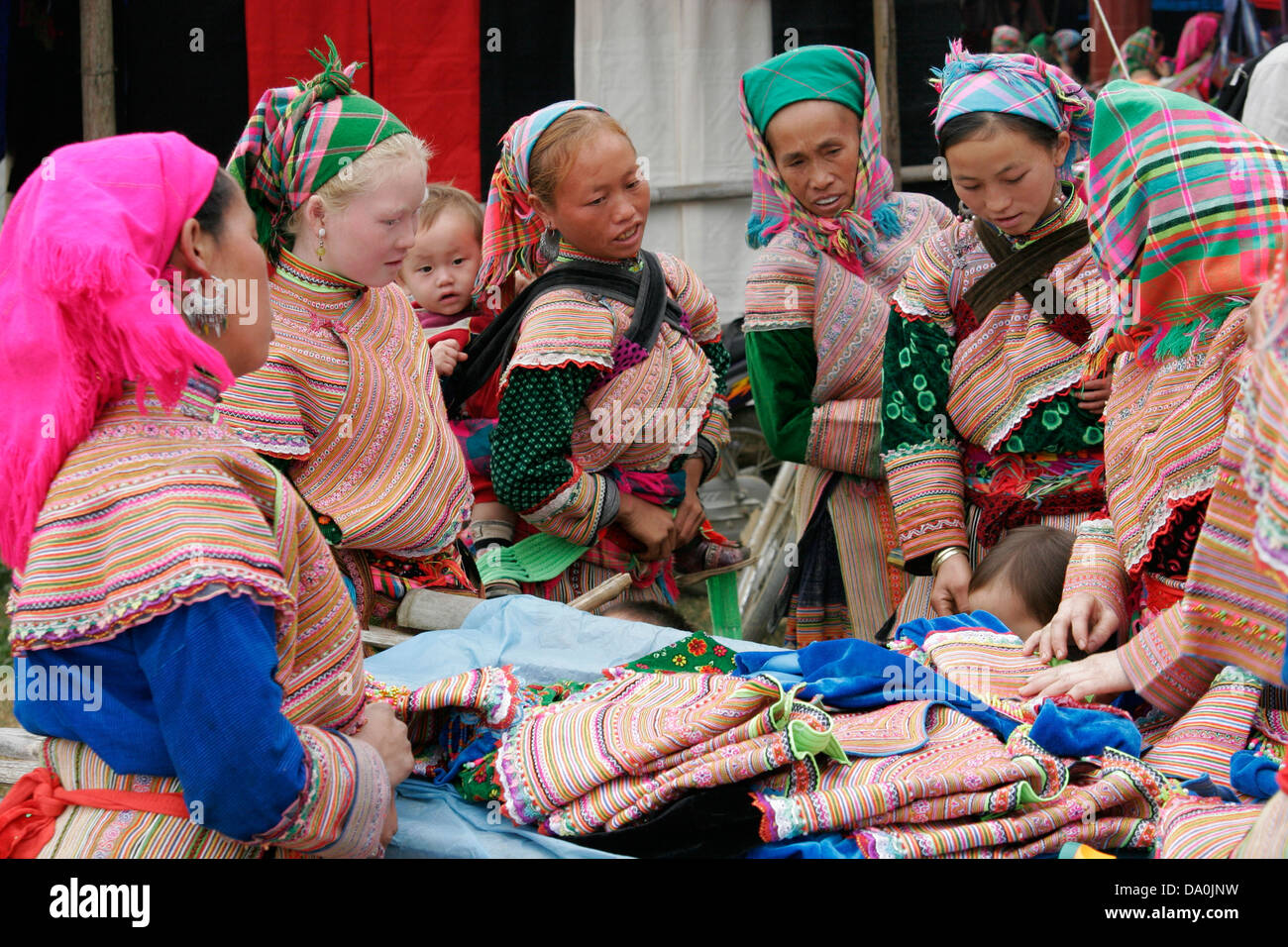 Colorfully dressed Flower Hmong women at the market in Bac Ha, Vietnam ...