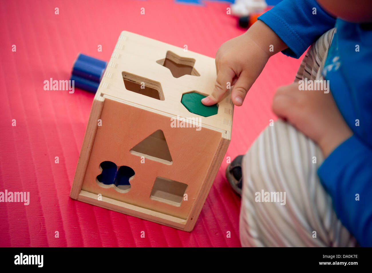 Child playing with shape sorter hi-res stock photography and images - Alamy