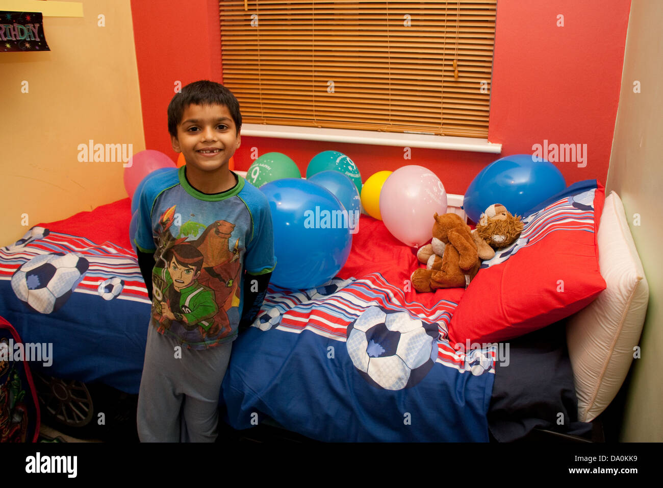 Boy in bedroom Stock Photo - Alamy