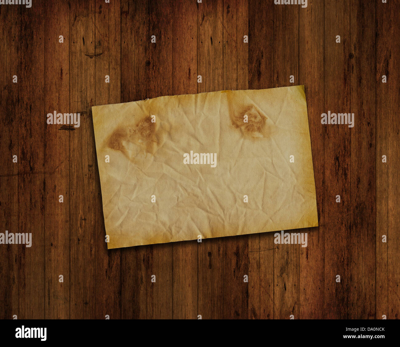 Old piece of paper on a grunge wood wall Stock Photo - Alamy