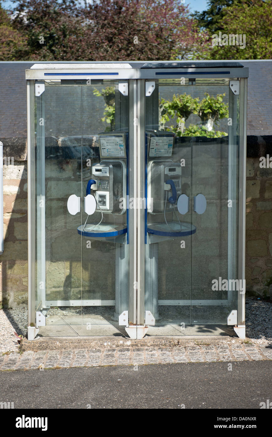 Two glass French telephone boxes Stock Photo - Alamy