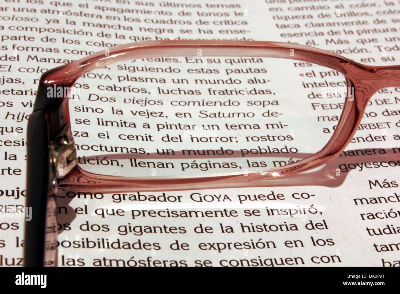 The text of a book through the lens of a glass Stock Photo - Alamy