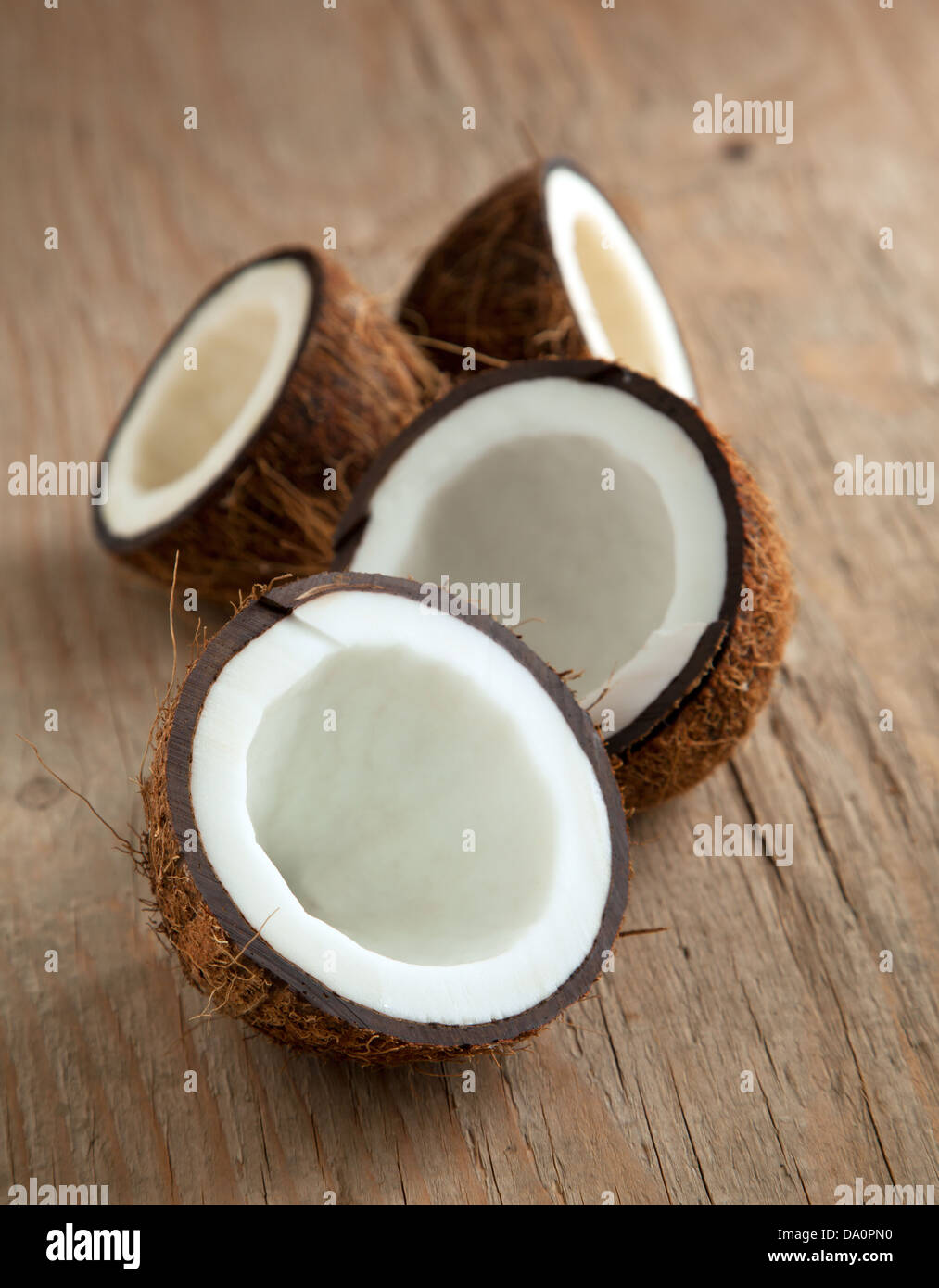 Coconuts on wooden background Stock Photo - Alamy