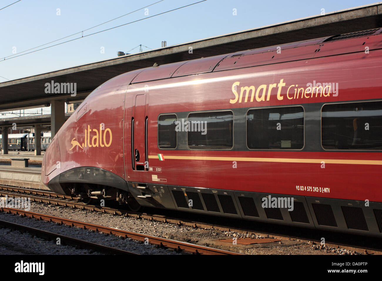 Italian burgundy red high speed train Italo in Venice Stock Photo - Alamy