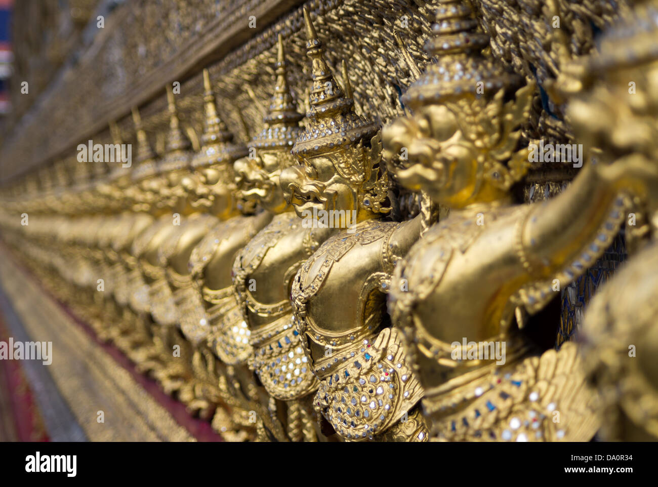 Gold plated statues at Grand Palace in Bangkok, Thailand Stock Photo ...