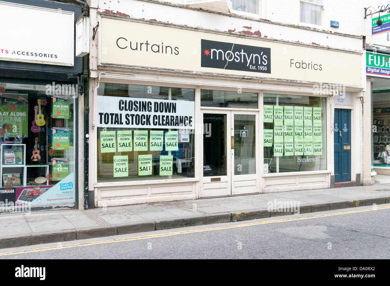 Shop closing down stock clearance posters Stock Photo - Alamy