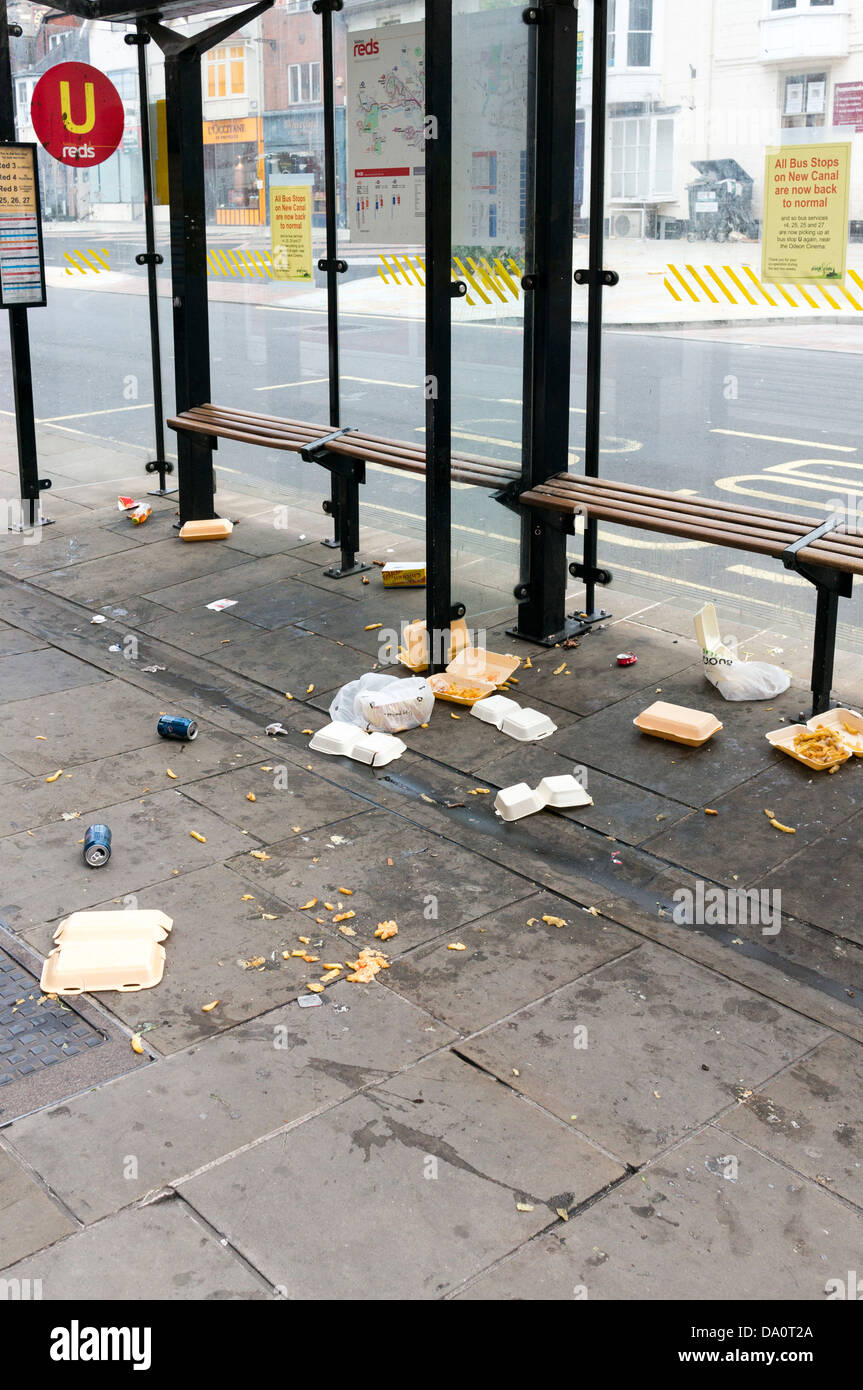 Wasted food and polystyrene cartons littering a bus shelter in the UK ...
