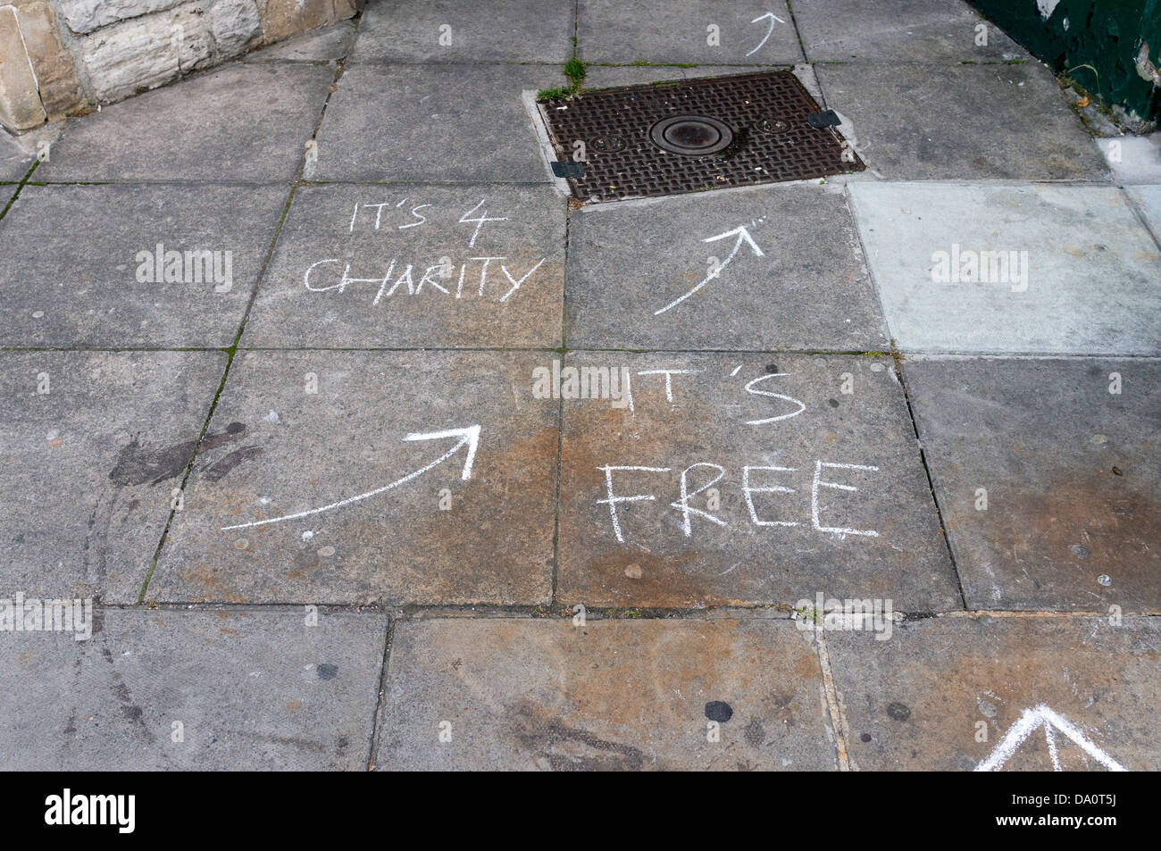 Chalk writing and arrows on sidewalk pavement UK Stock Photo - Alamy