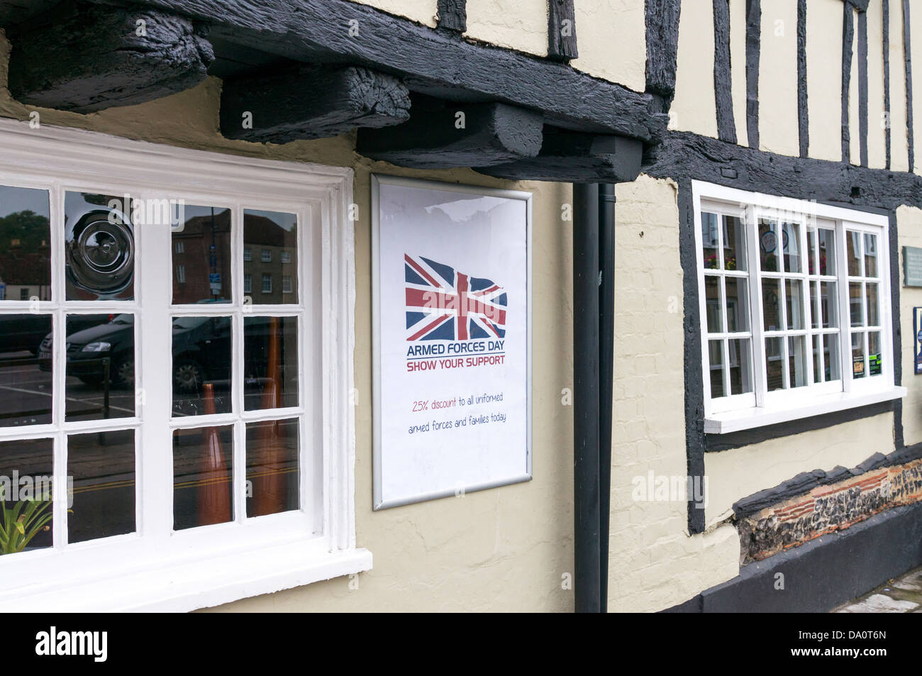 UK Armed Forces day celebration poster on the wall of a pub with Union ...