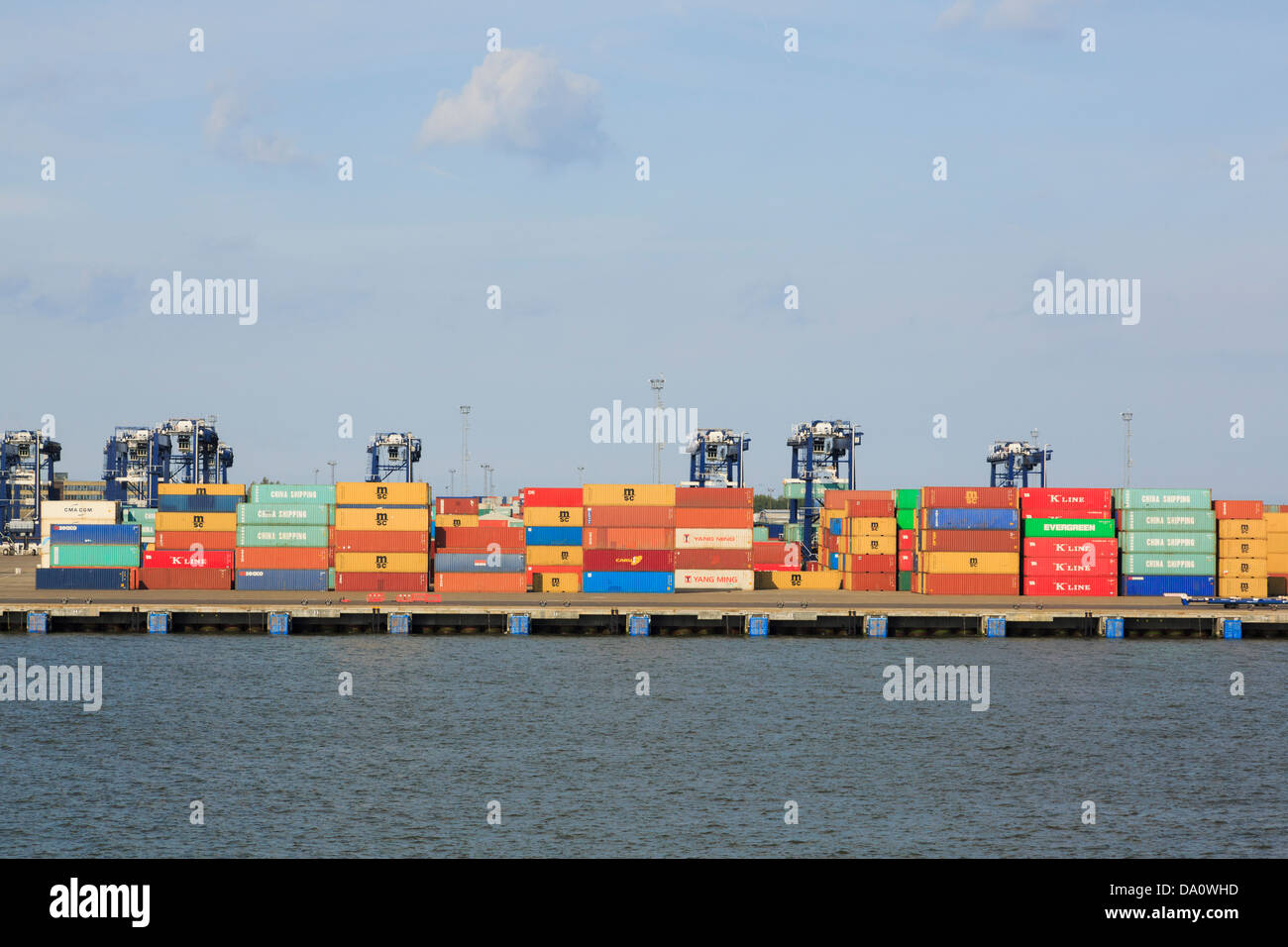 Containers stacked on dockside terminal quay of largest container port ...