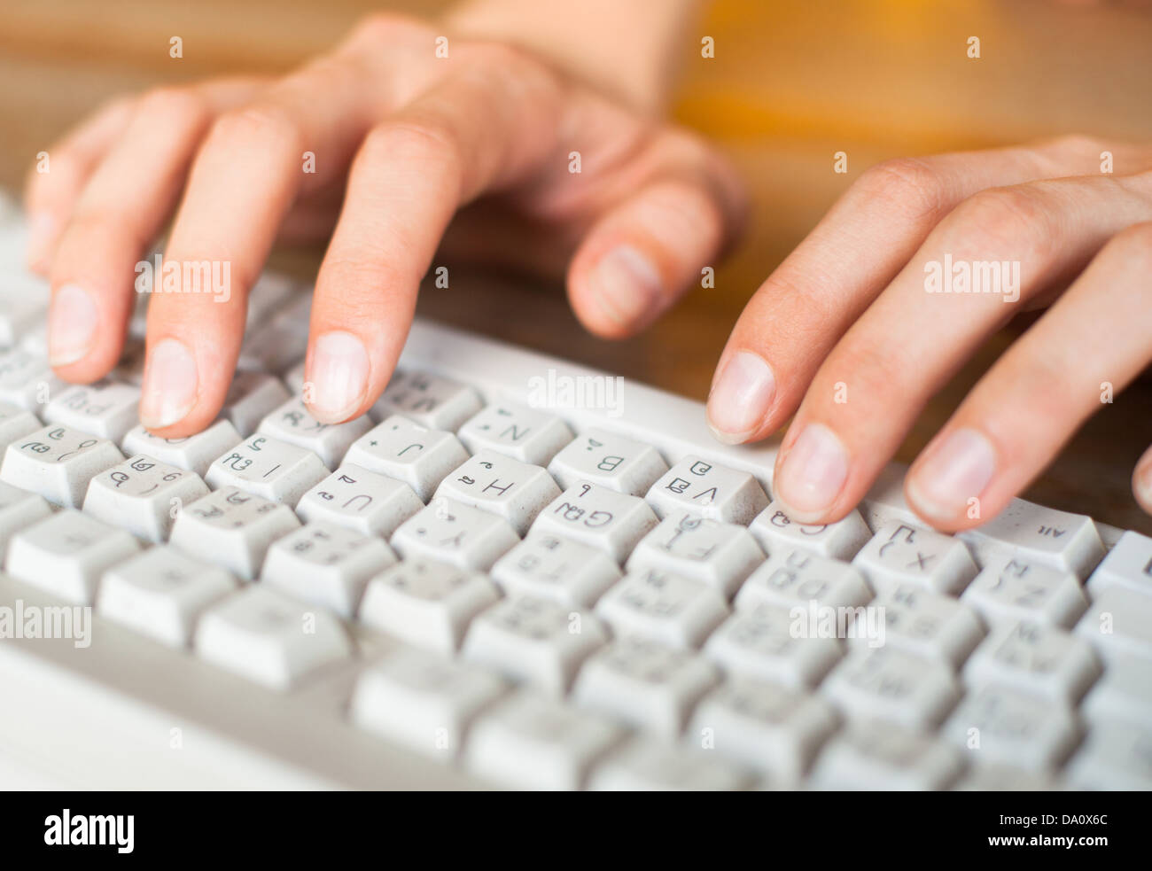 Female hands typing text on a computer keyboard Stock Photo - Alamy