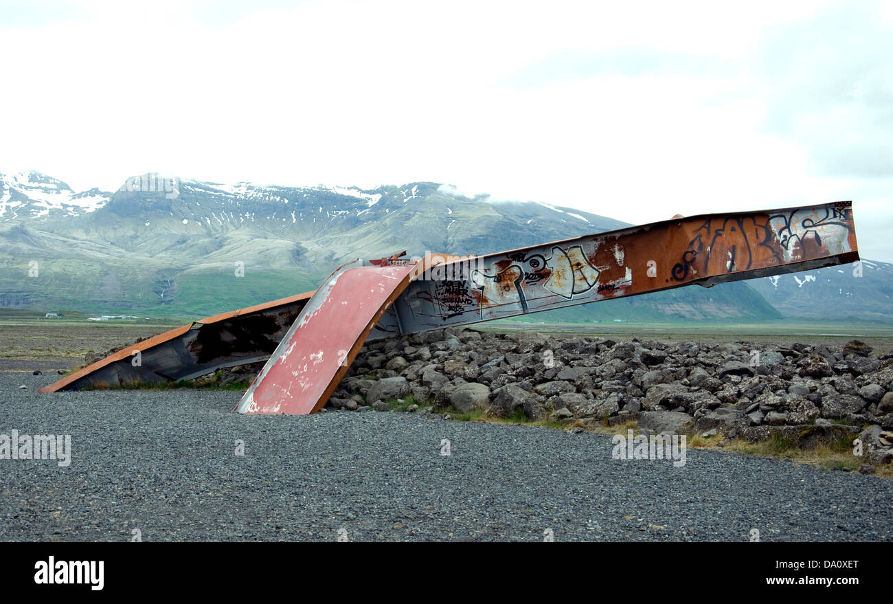 On Iceland's south coast the twisted strut of an iron bridge destroyed ...