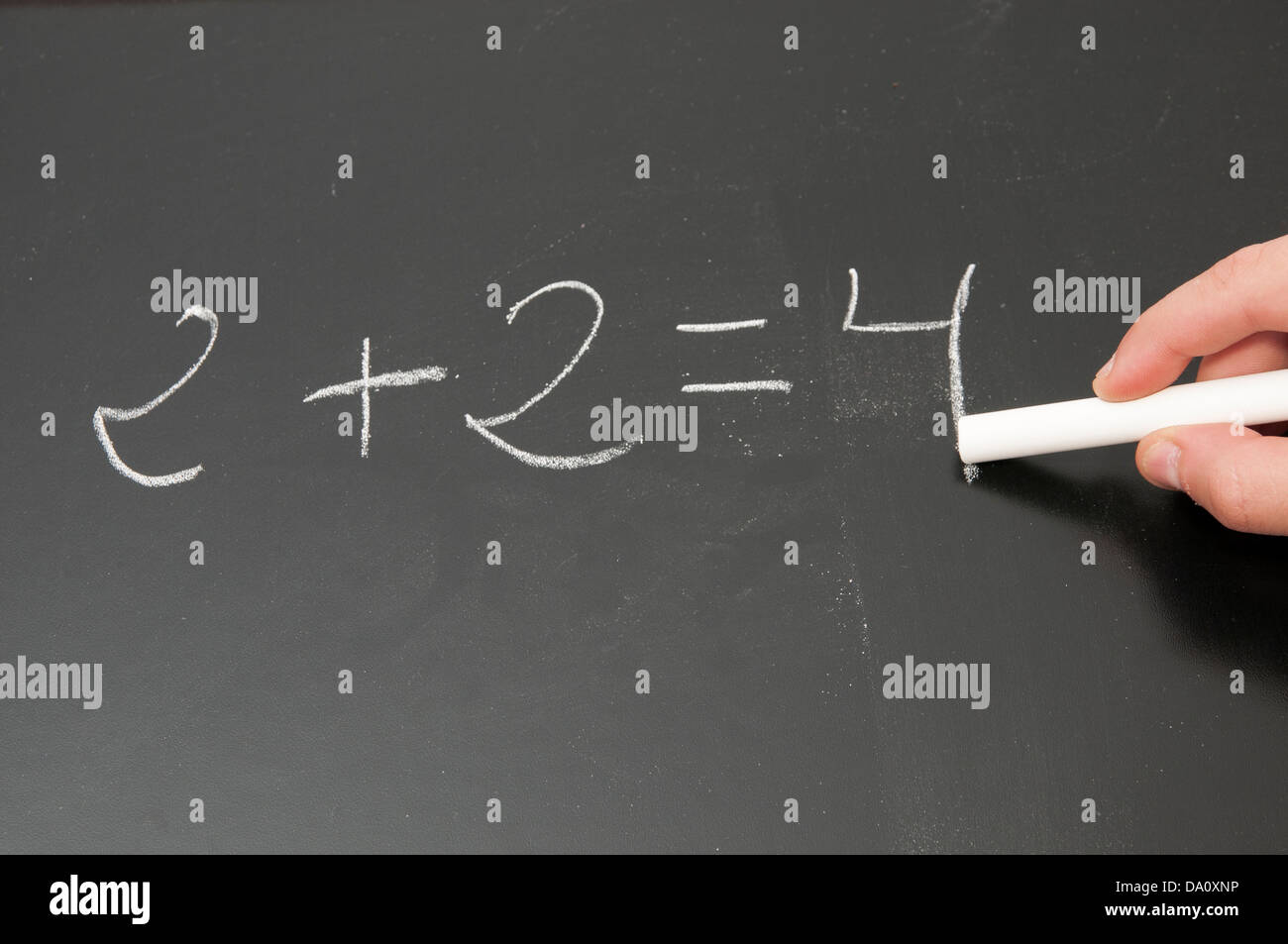 doing a sum on the blackboard with chalk Stock Photo - Alamy