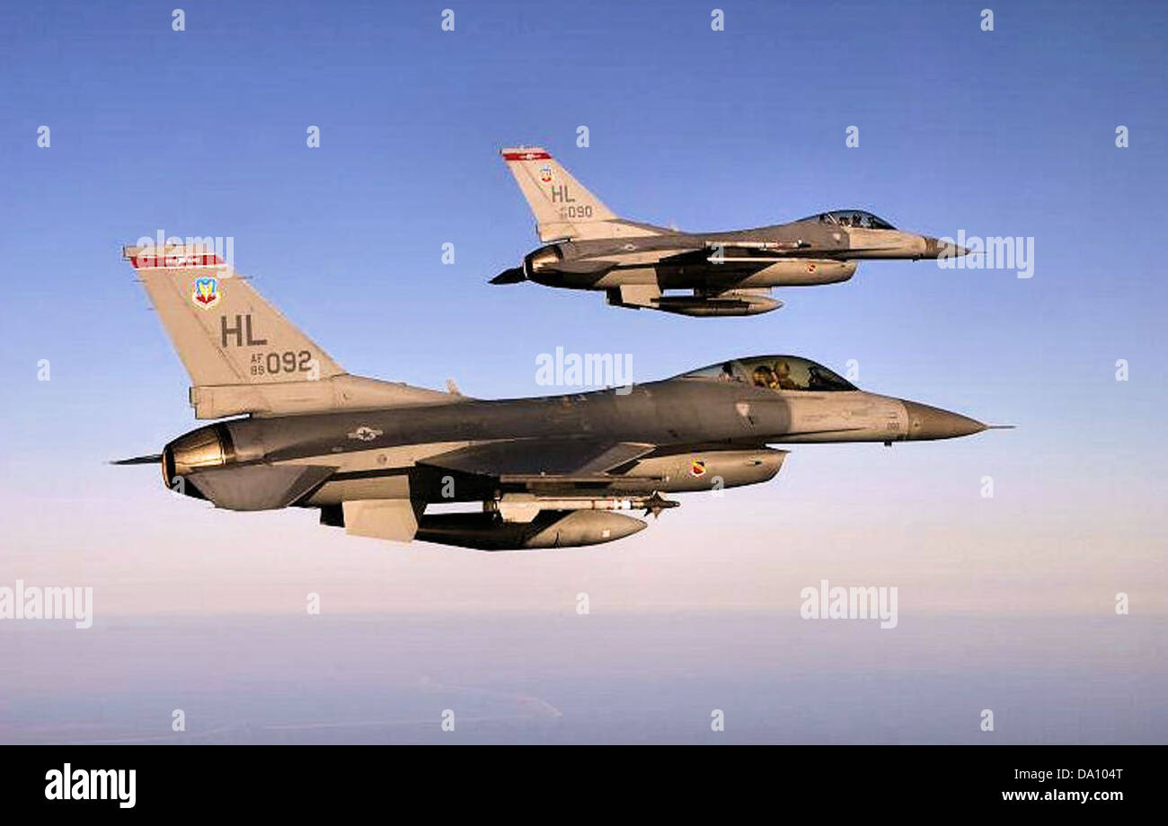The 34th Fighter Squadron's two F-16 Fighting Falcons fly in formation ...