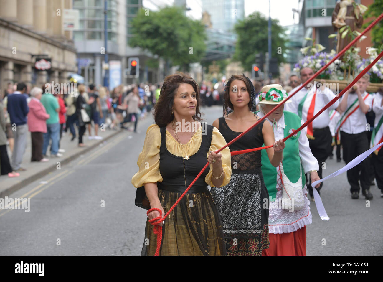 Manchester, UK. 30th June, 2013. iWomen in regional Italian dress walk ...