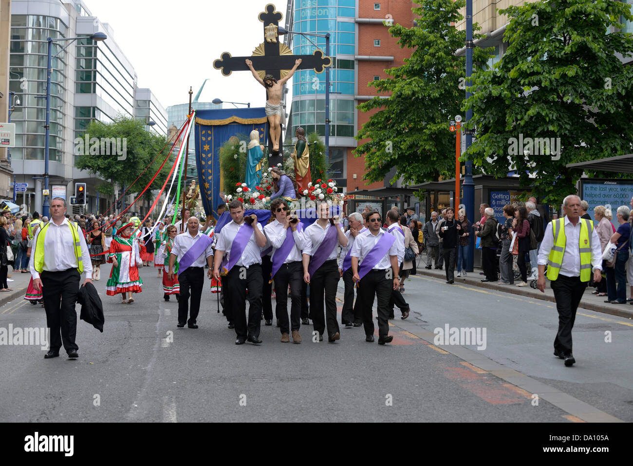 Manchester, UK. 30th June, 2013. Men carry a large crucifix in the ...