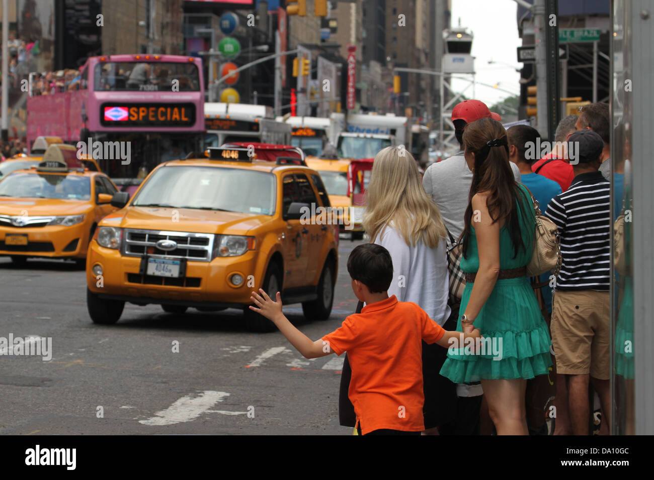 New York, June 24 2013. Tourist hail a yellow taxi on 7th Avenue in ... New York, June 24 2013. Tourist hail a yellow taxi on 7th Avenue in ...