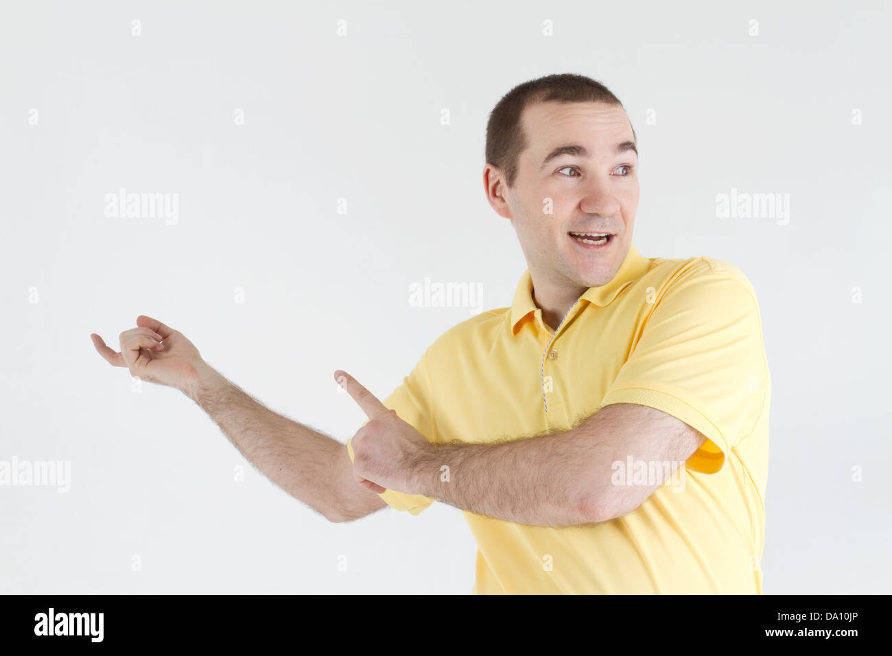 surprised man points out off somewhere on a light background Stock ...