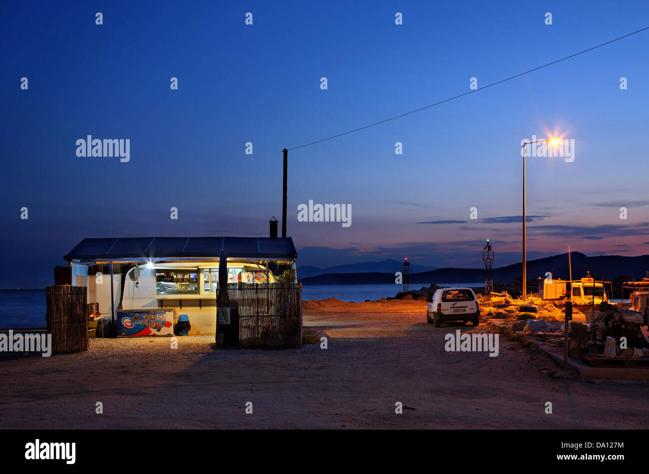 "Blue hour" at a lonely canteen, next to the fishing port of Nea Styra ...