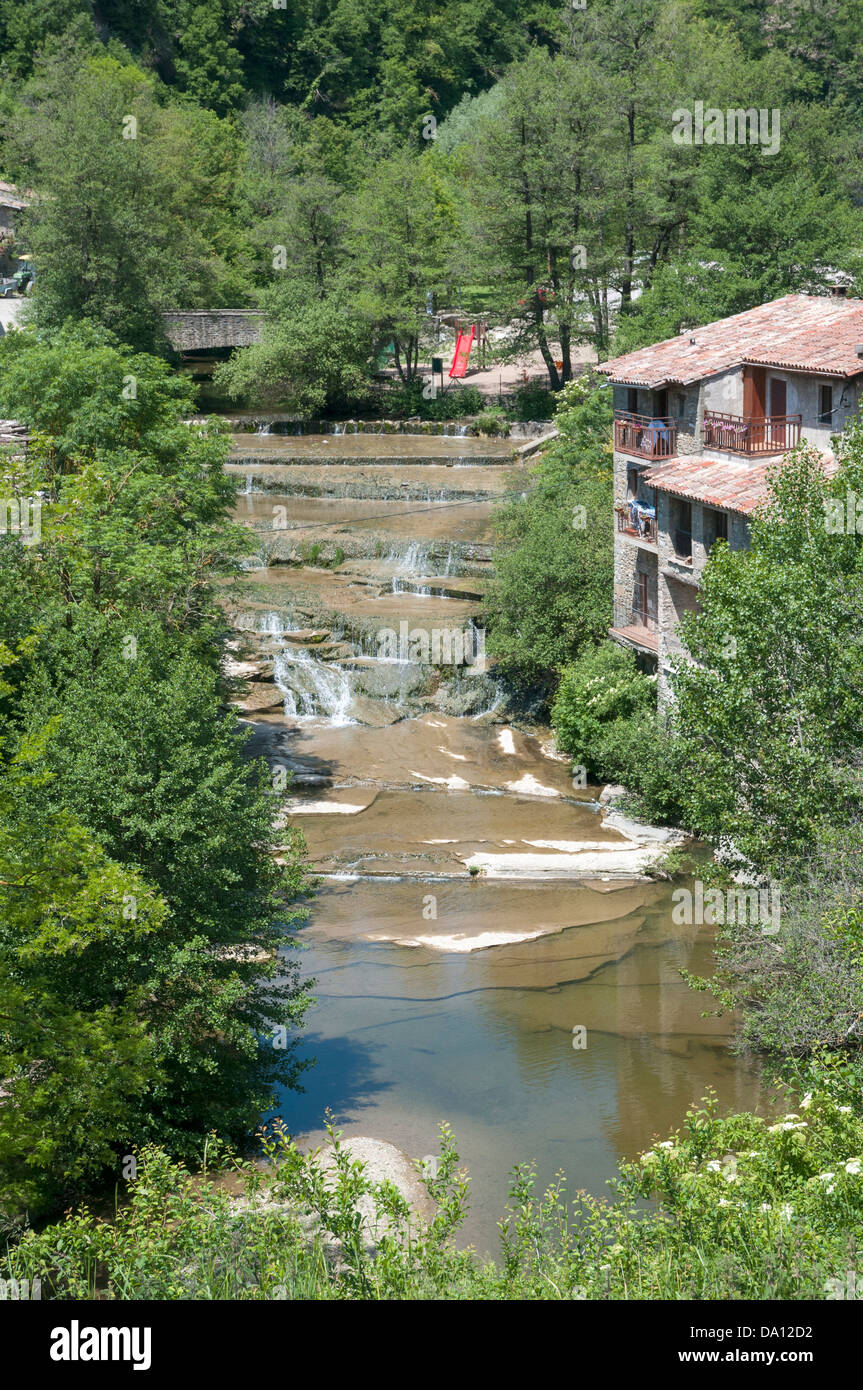 Rupit village through which the river Stock Photo - Alamy