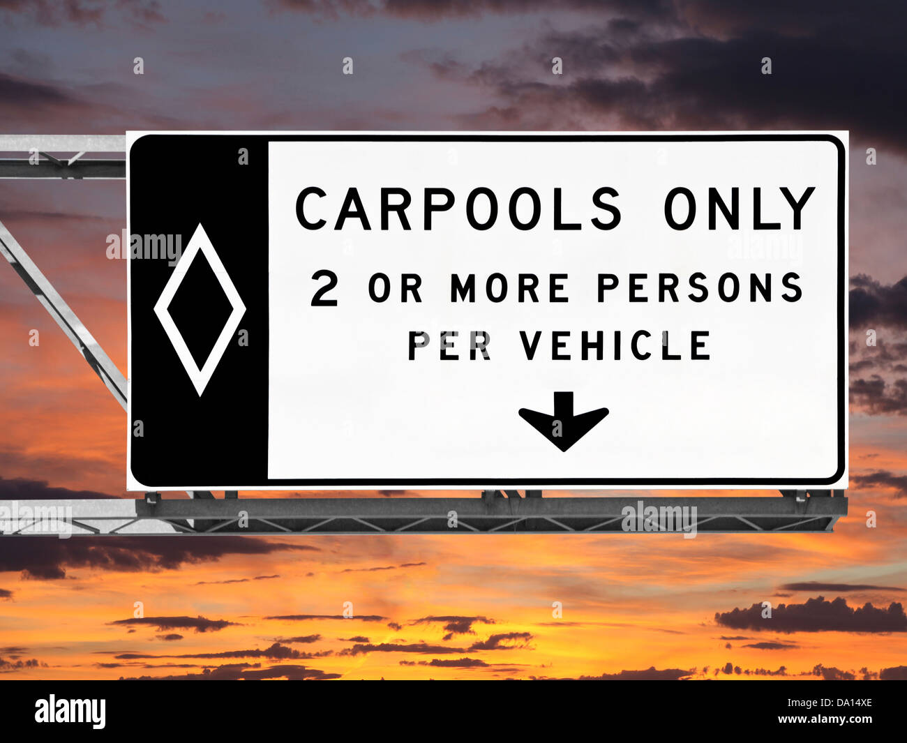 Overhead freeway carpool only sign with sunset sky Stock Photo - Alamy