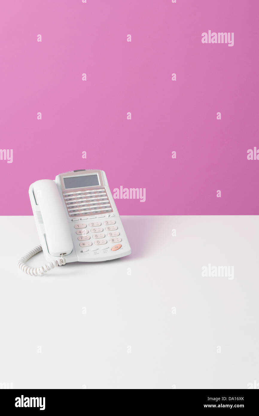 Telephone on desk Stock Photo - Alamy