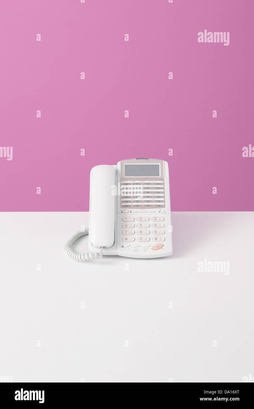 Telephone on desk Stock Photo - Alamy