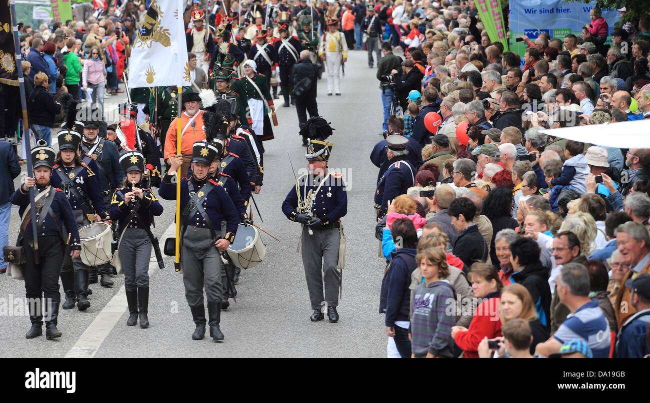 Men in historical uniforms march past a crowd on occasion of the 17th ...