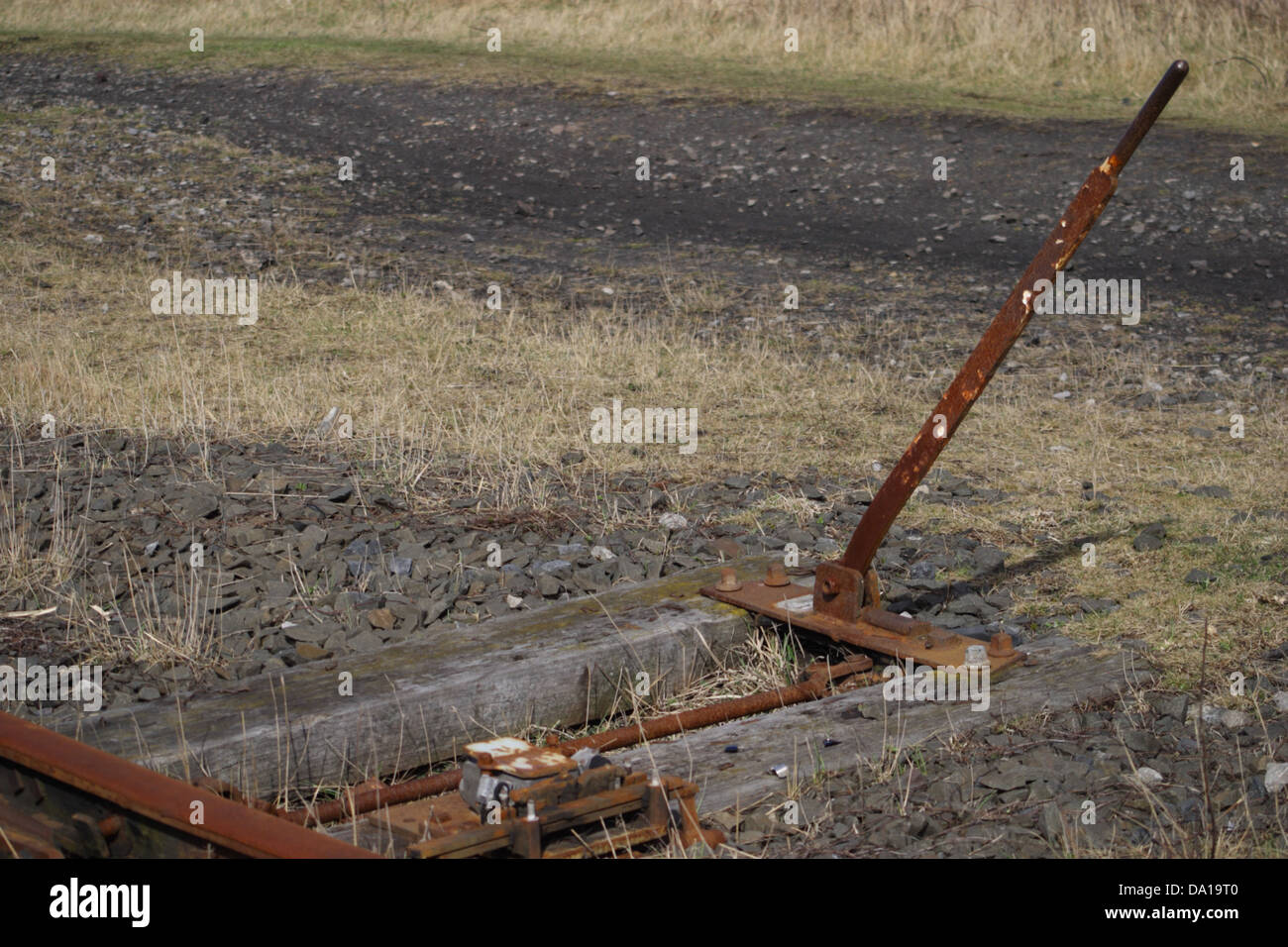 Close up of old and rusty Railway point lever at the side of disused ...