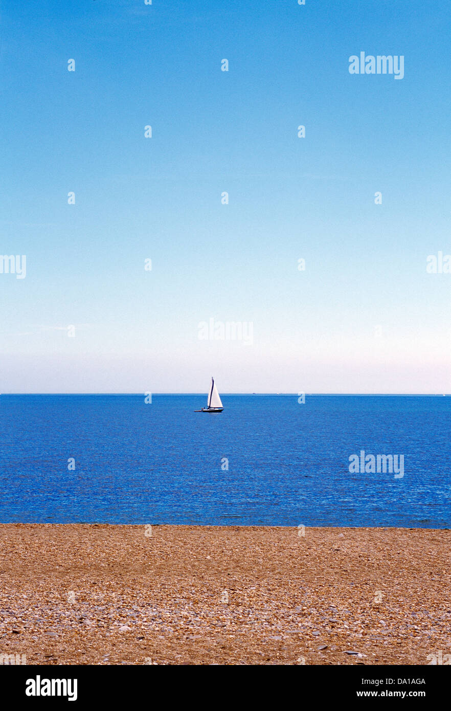 Yacht sailing in coastal waters Stock Photo - Alamy