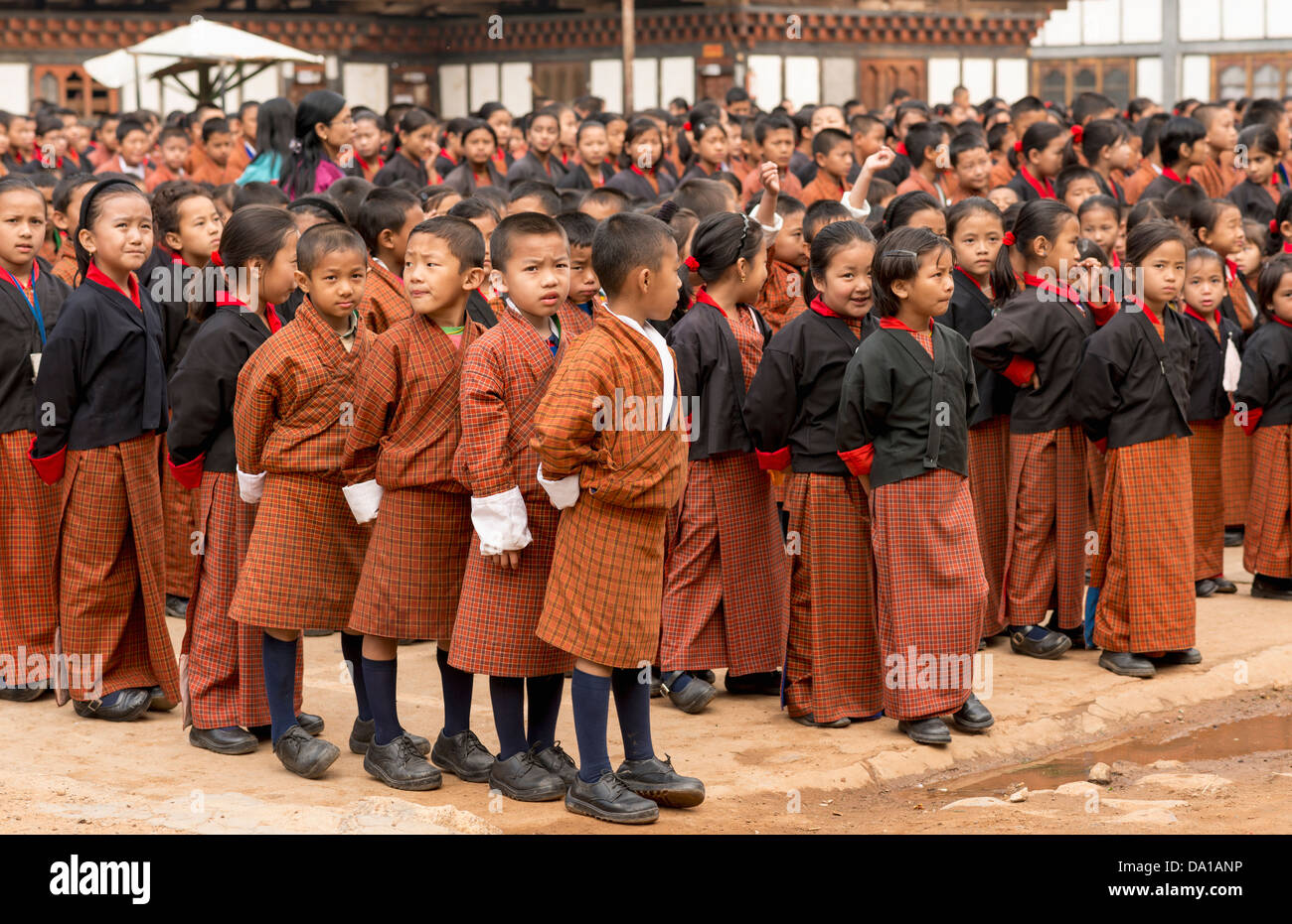 Bhutan, Children standing in row for morning prayer Stock Photo - Alamy
