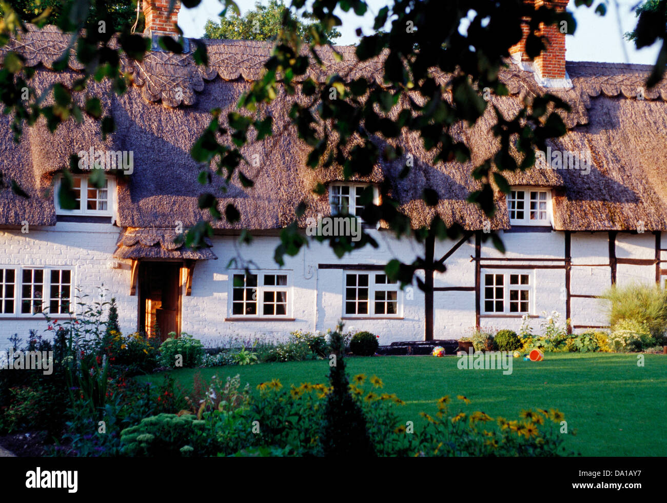 Thatched cottages in summer Wherwell Hants. England, UK Stock Photo - Alamy