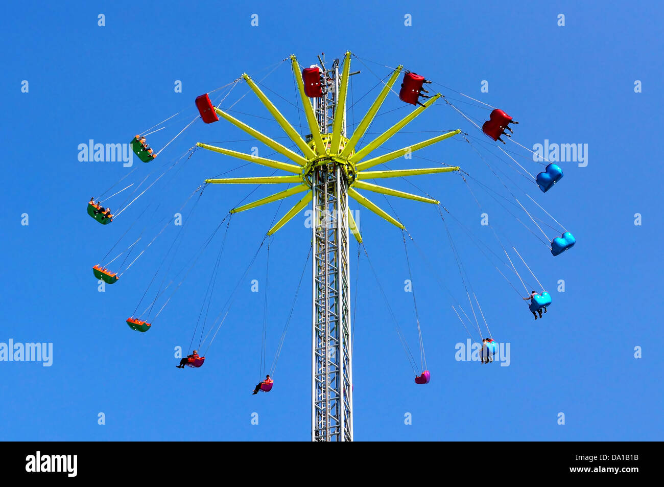 Germany, Chairoplane against blue sky Stock Photo - Alamy