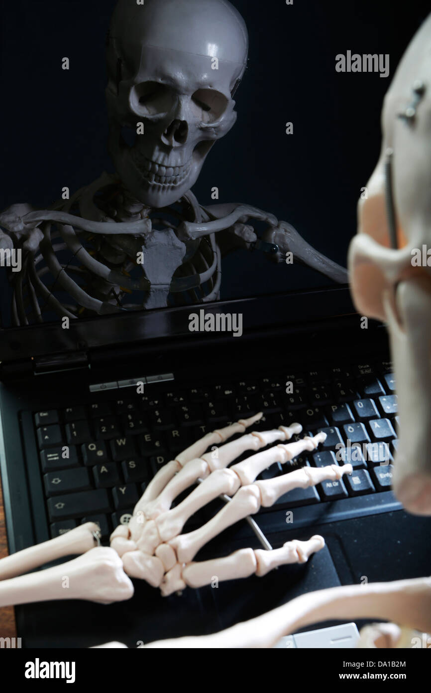 Skeleton reflecting in monitor of computer Stock Photo - Alamy