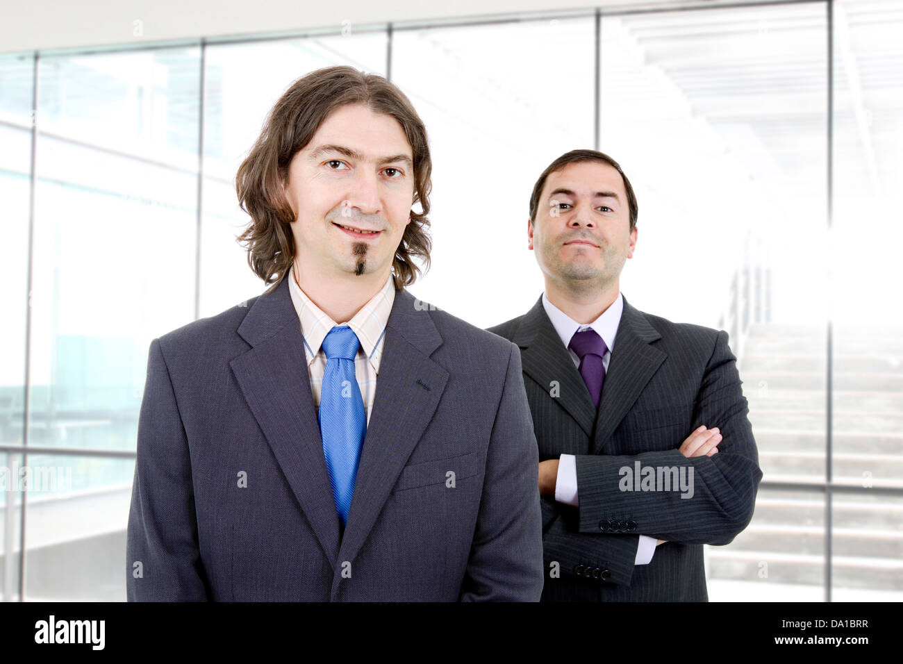 two young business men portrait at the office Stock Photo - Alamy