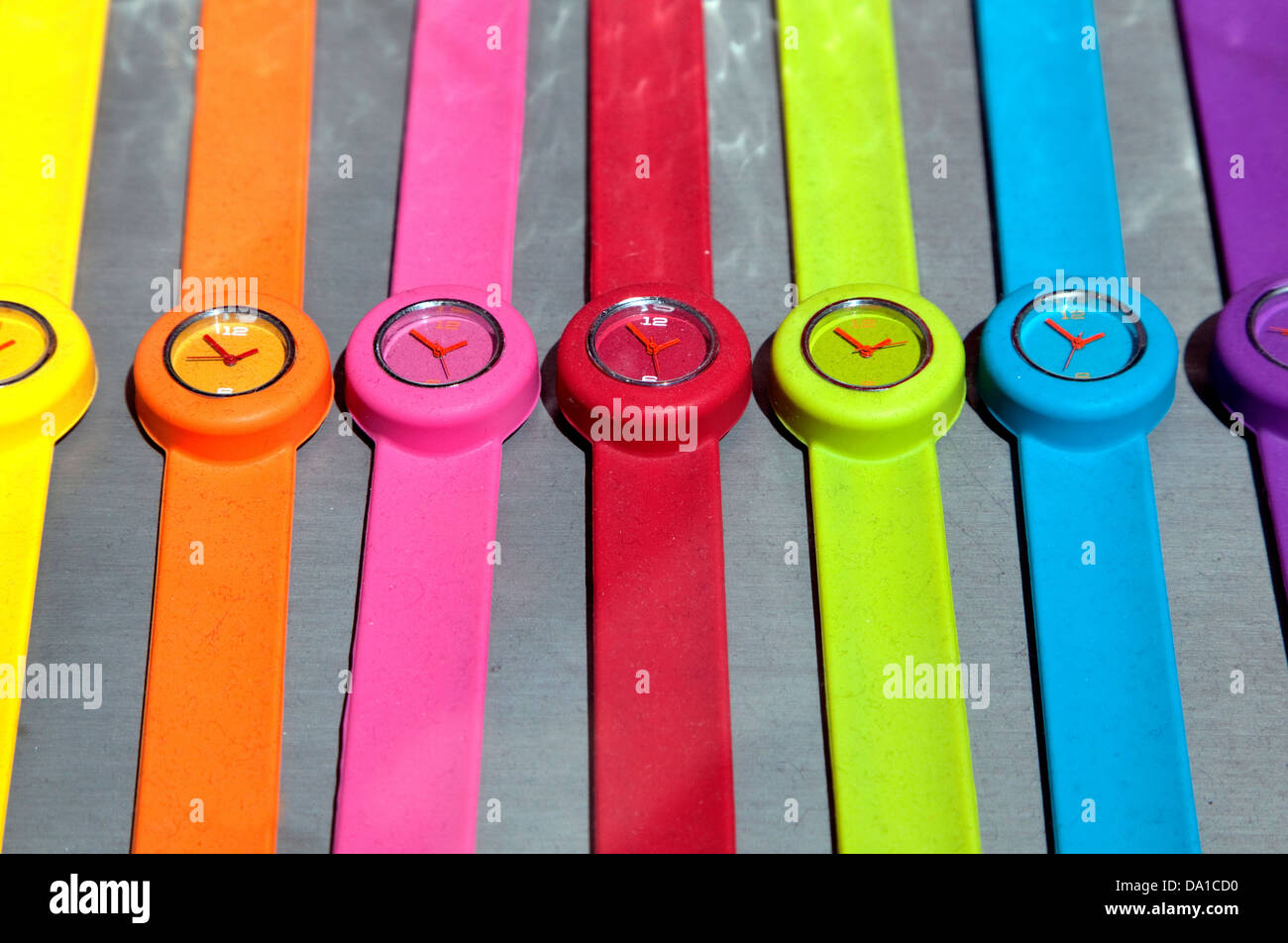Brightly coloured watches displayed in shop window in Carnaby Street ...