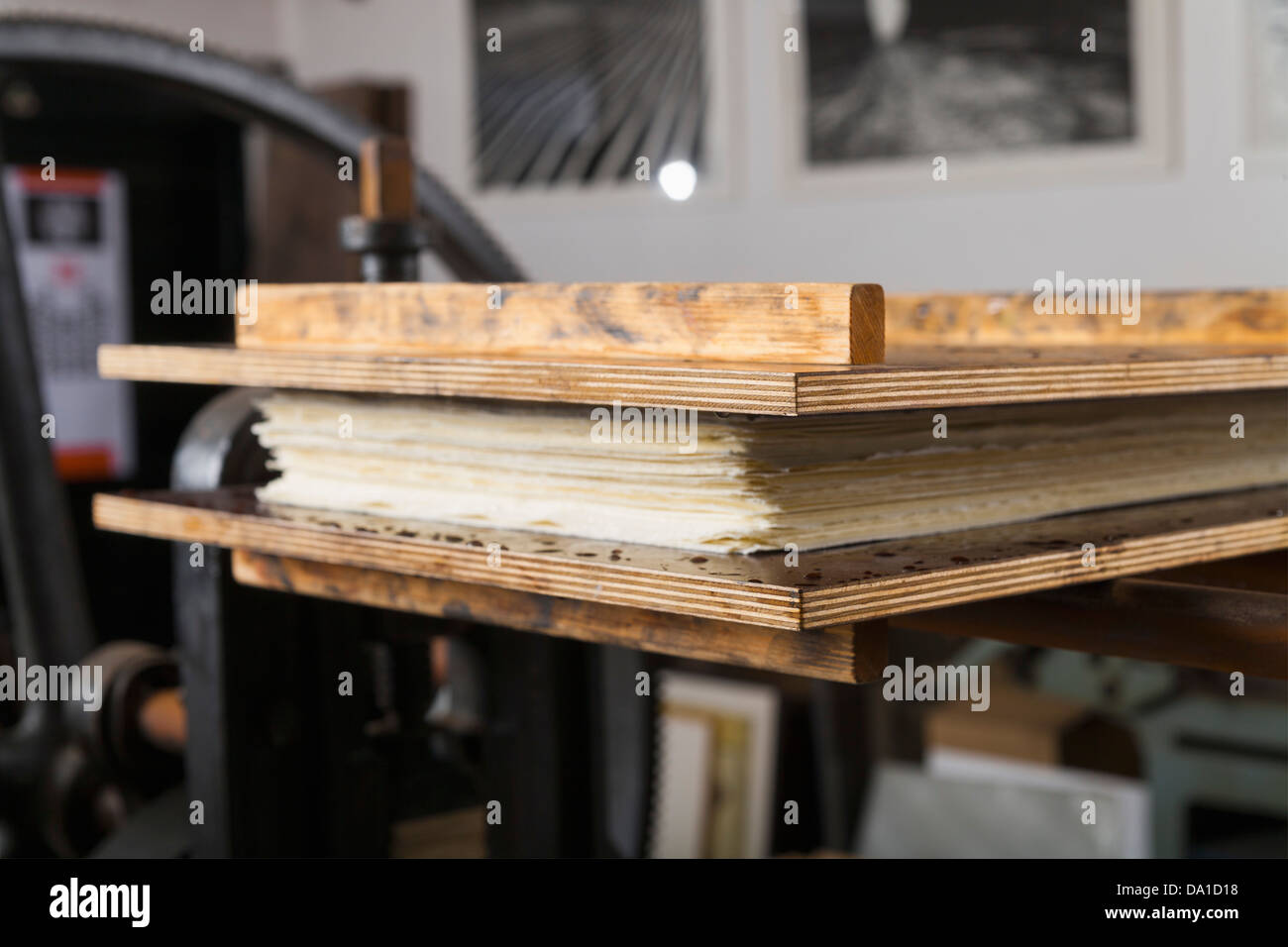 Germany, Bavaria, Stack of deckle edge paper in print shop, close up ...