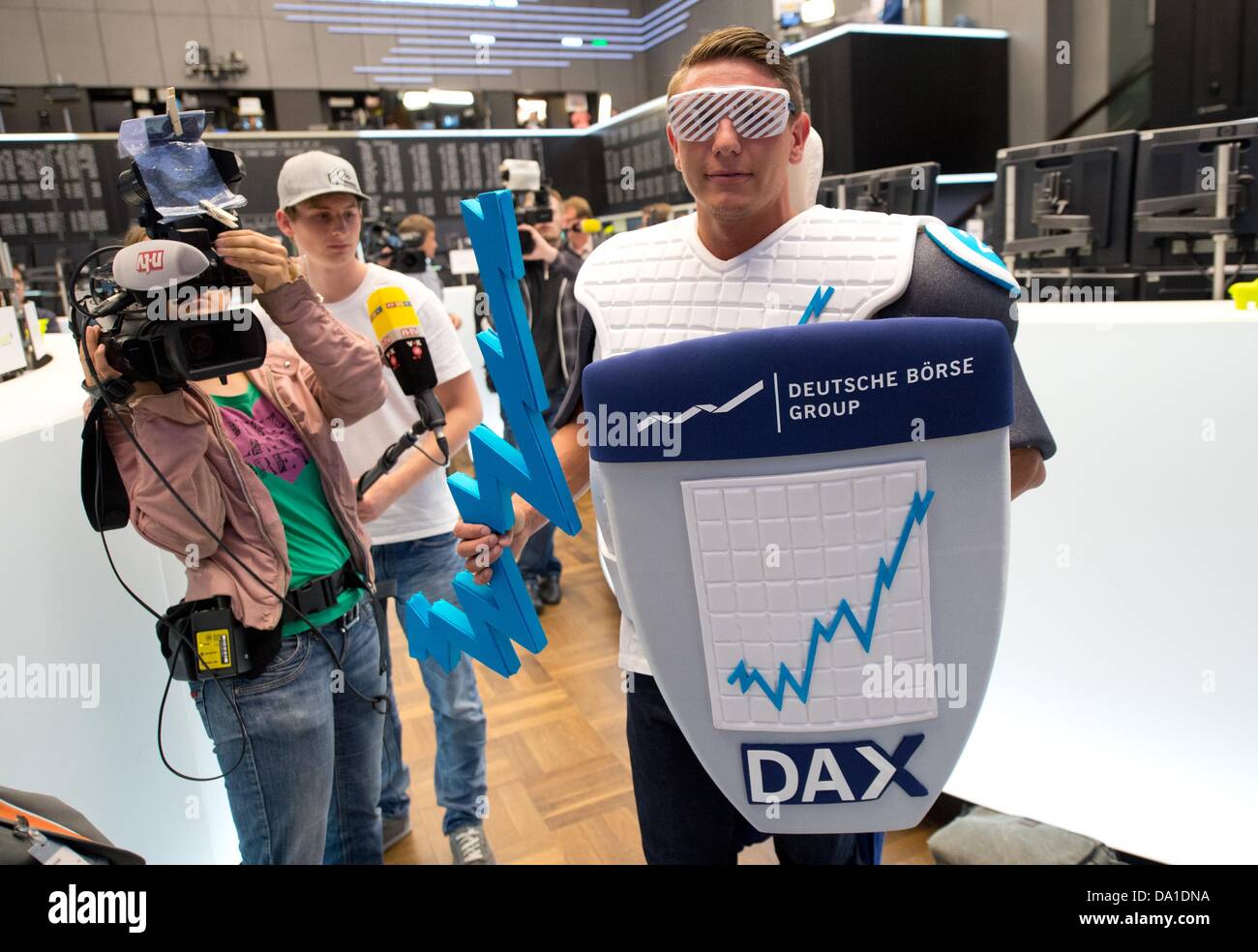 A man in a 'DAX Superman' costume roams the floor on occasion of the ...