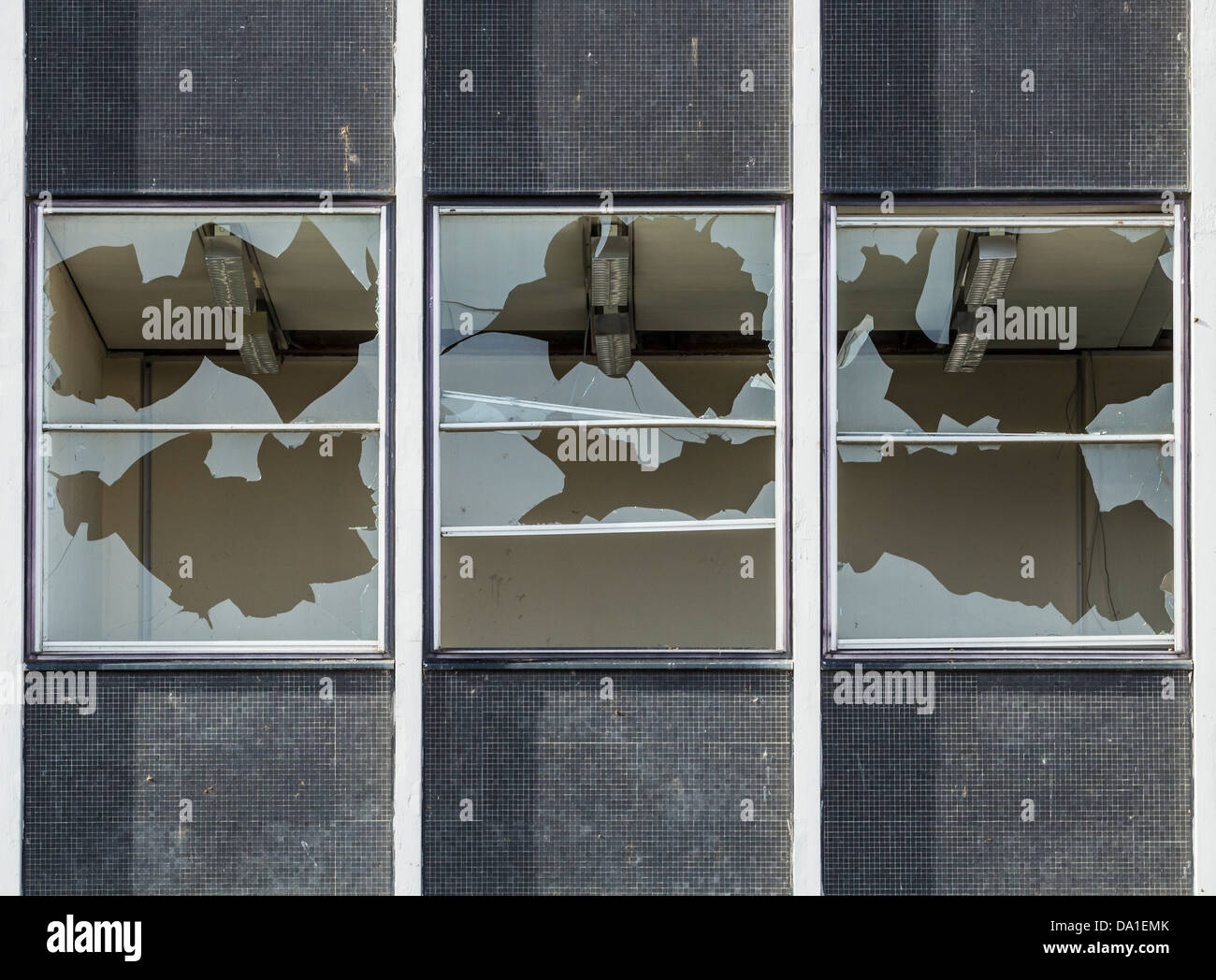 Broken window in empty office building Stock Photo - Alamy