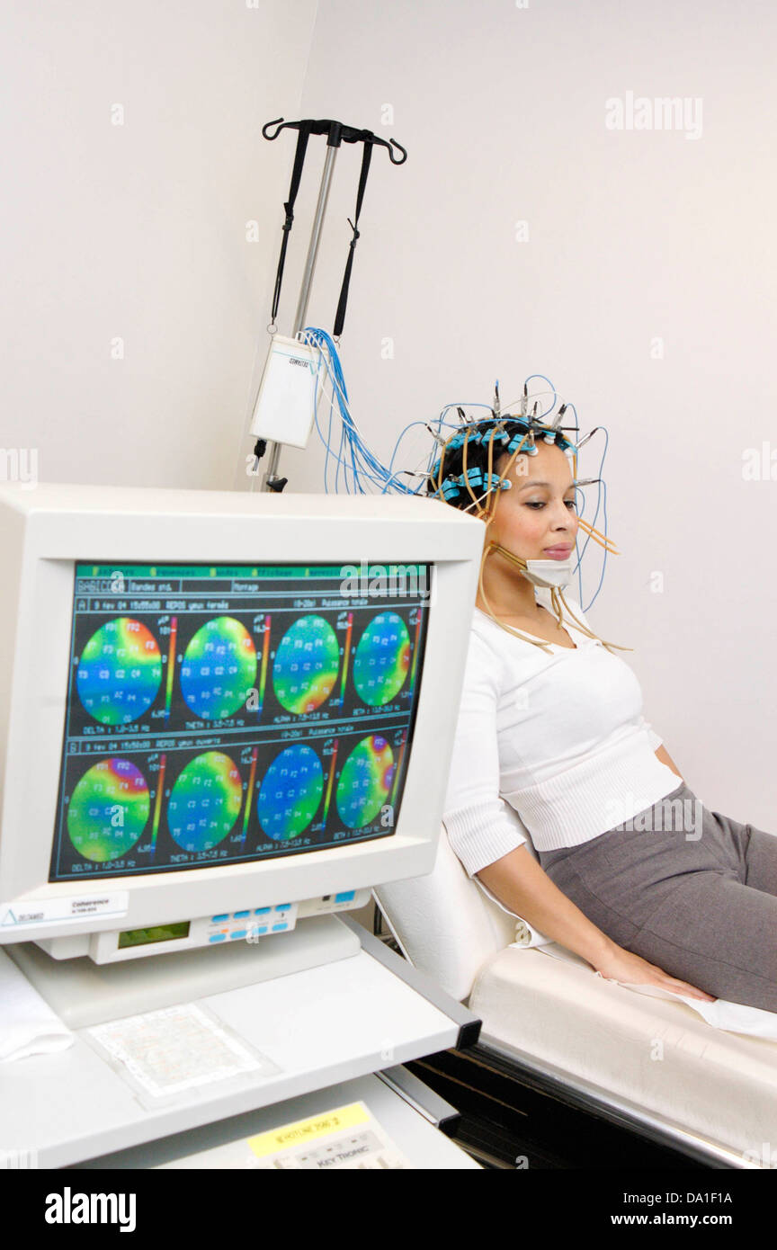 Woman undergoing electroencephalogram (eeg) hi-res stock photography ...