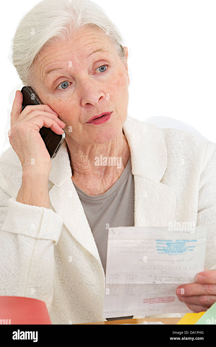 ELDERLY PERSON DOING PAPERWORK Stock Photo - Alamy