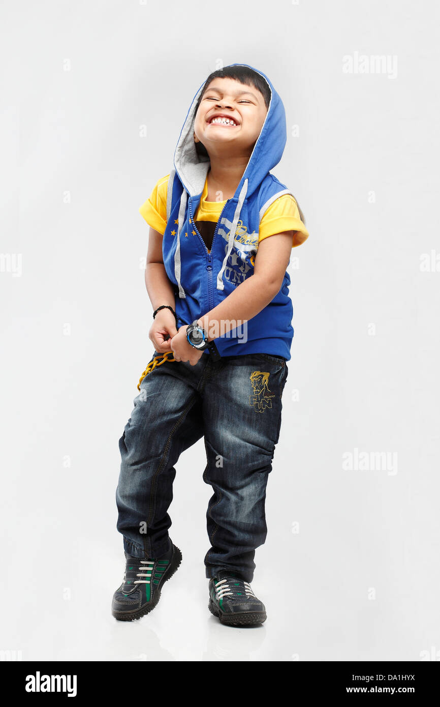 Little Indian kid is giving happy expression Stock Photo - Alamy