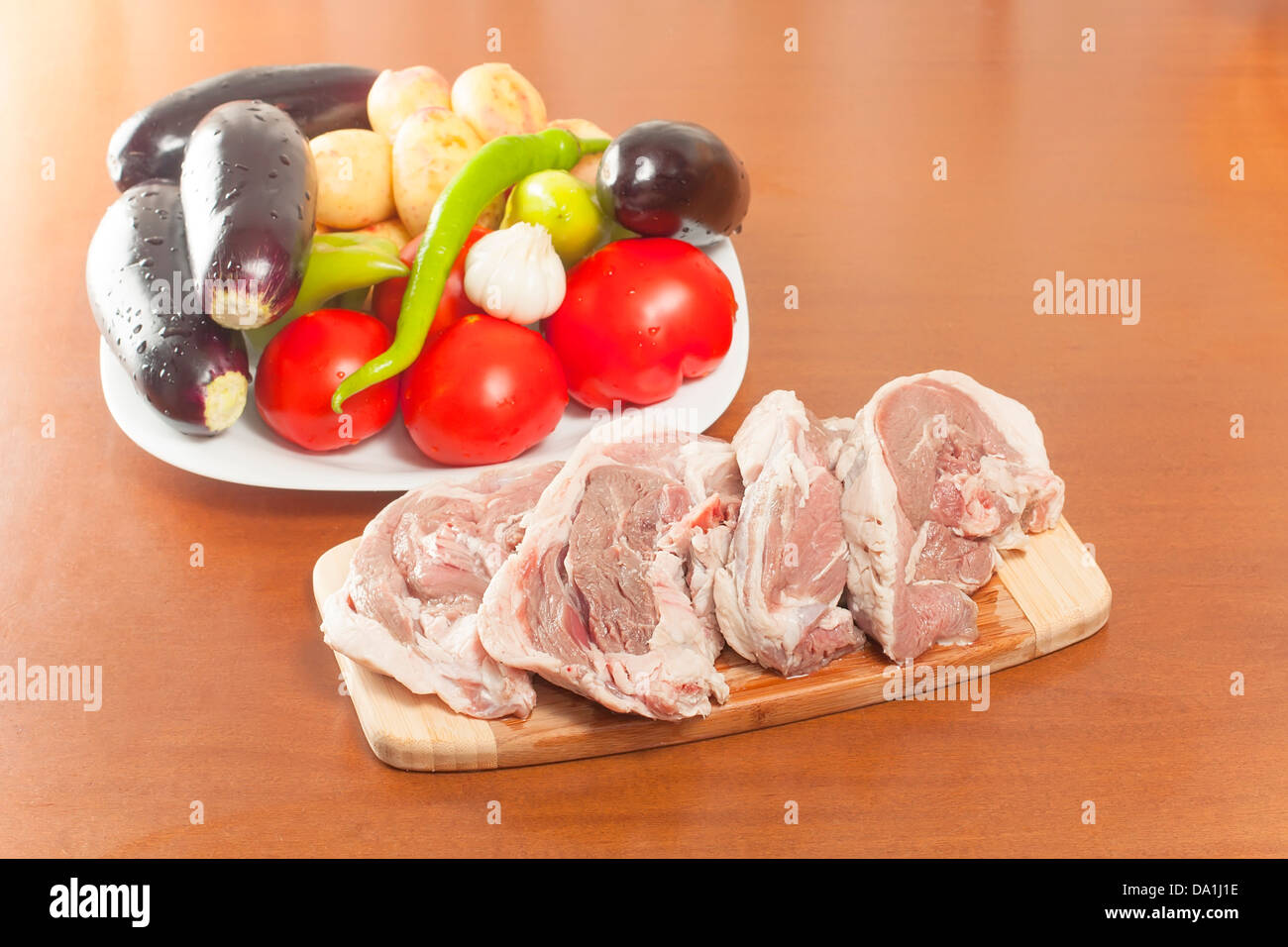 raw lamb meat with fresh vegetables Stock Photo - Alamy